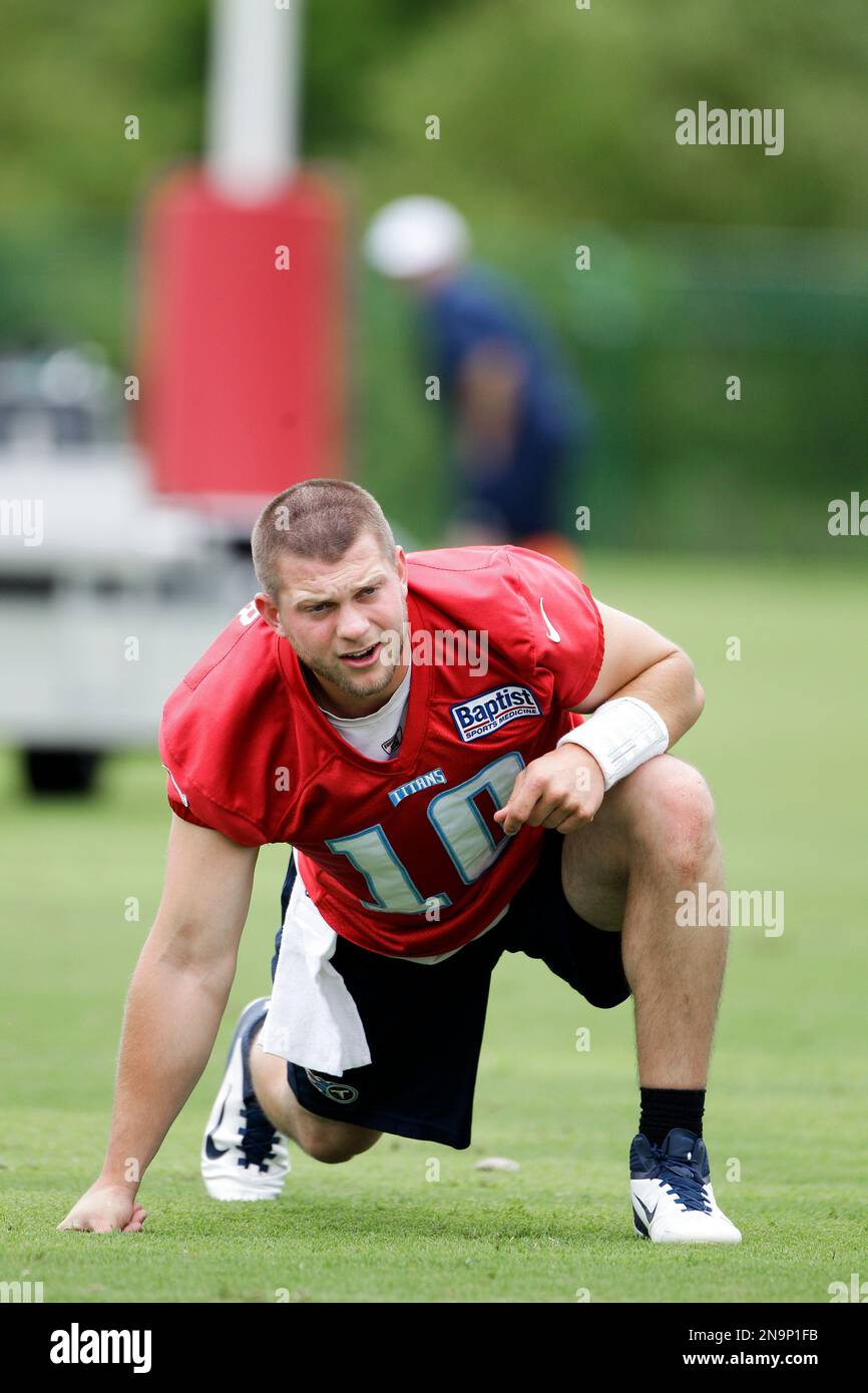 Tennessee Titans quarterback Jake Locker stretches during a workout at ...