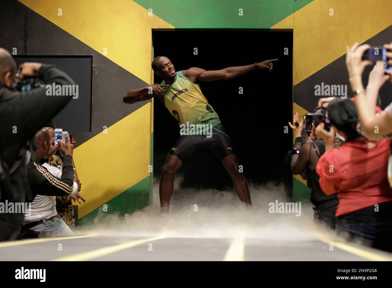 Jamaican sprinter Usain Bolt models a Jamaica Olympic kit designed by ...