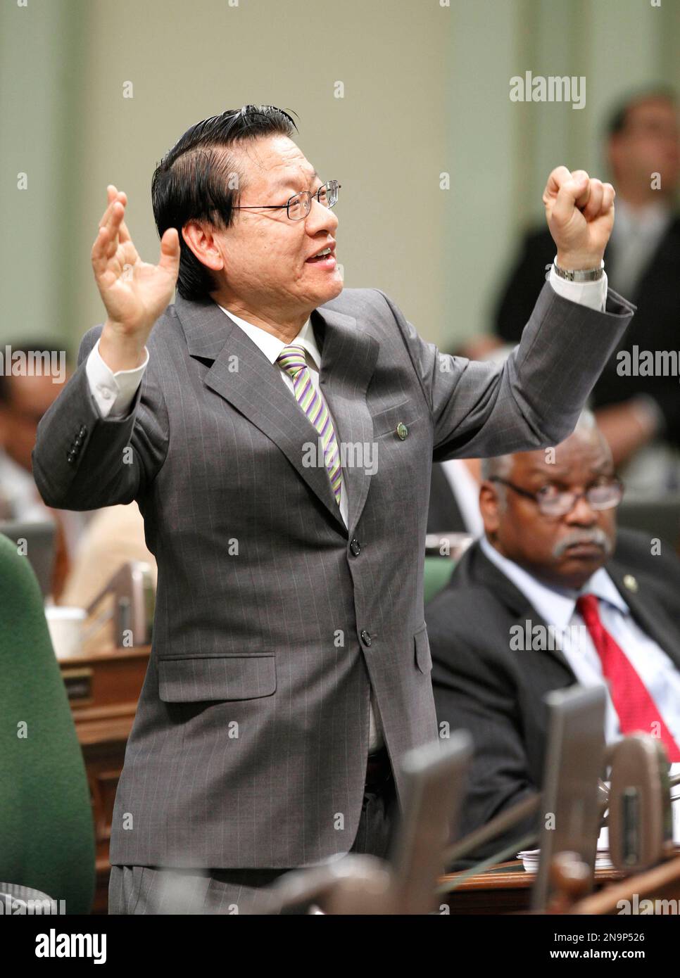 Assemblyman Mike Eng, D-Monterey Park, celebrates as his bill that ...