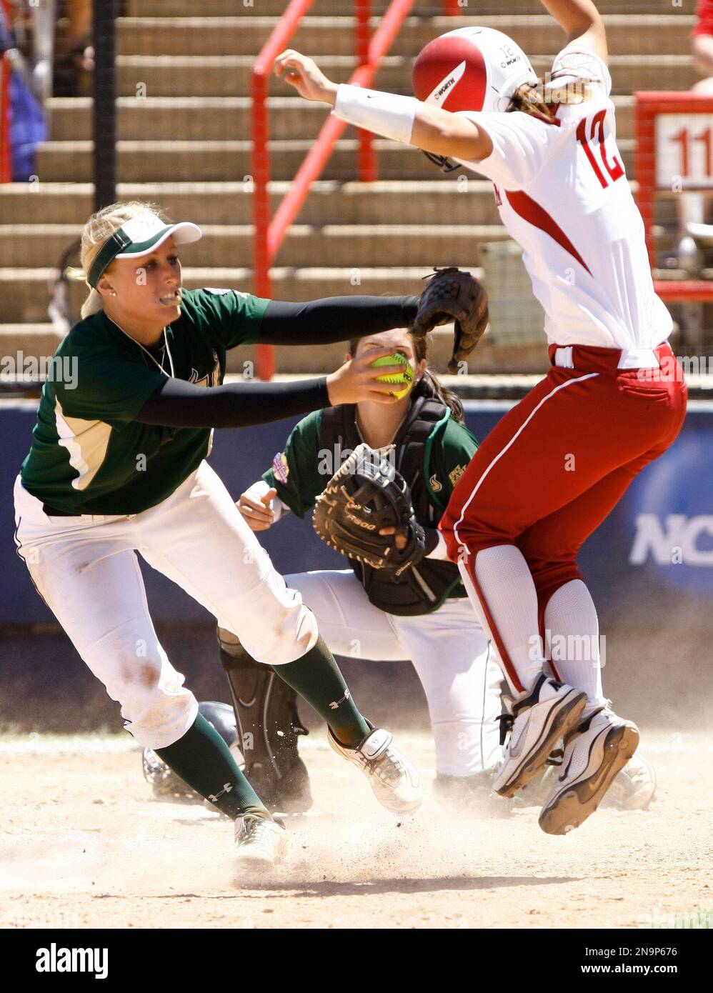 South Florida third baseman Jessica Mouse, left, tags out Oklahoma's ...