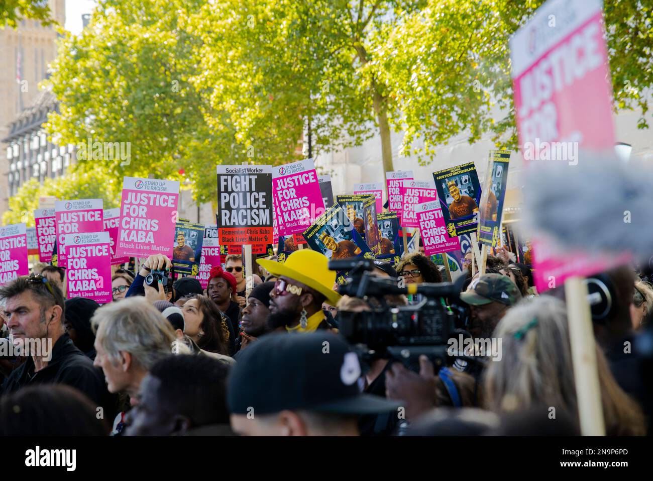 The demonstrators holding placards "justice for Chris" in front of new ...