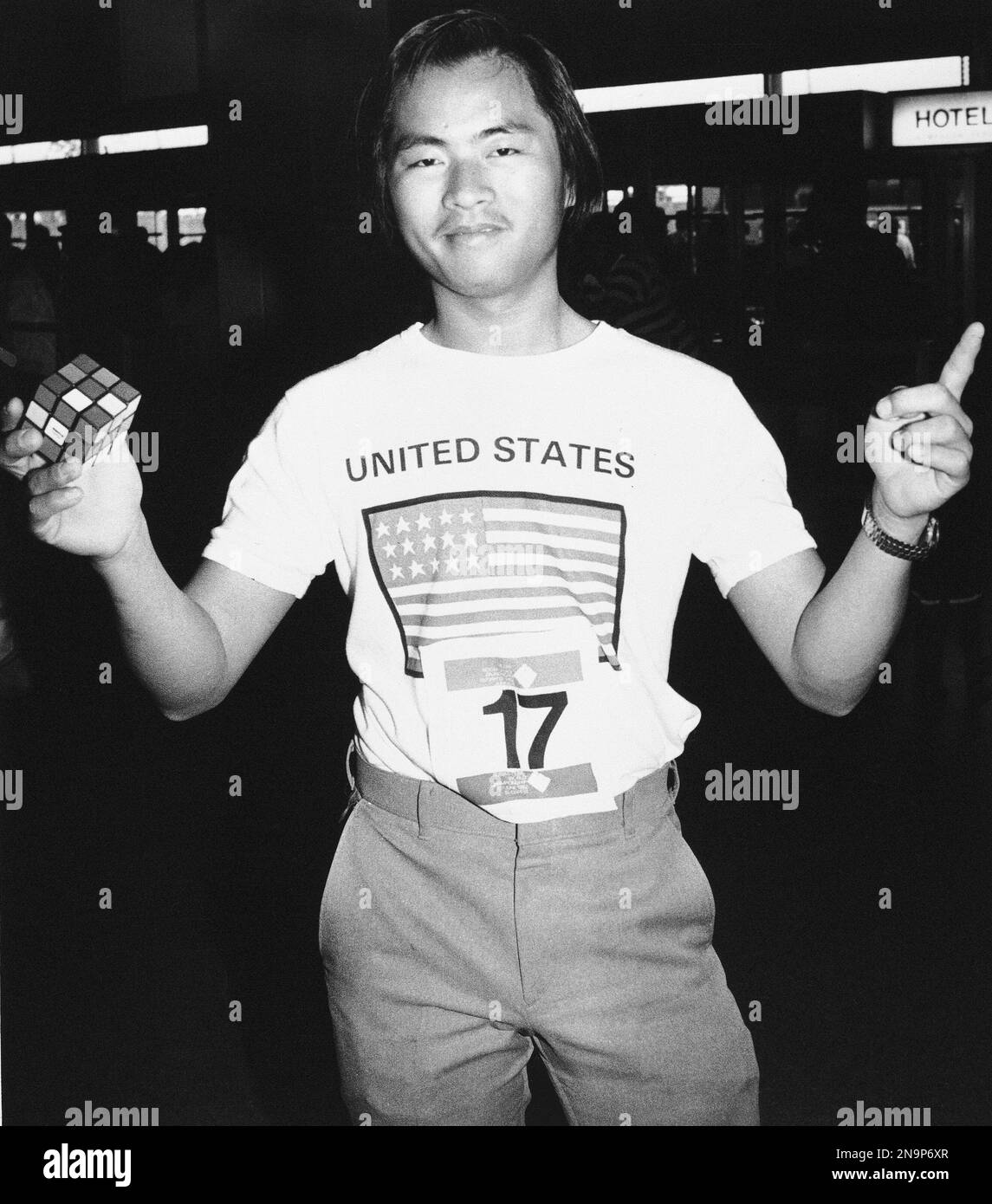 Seventeen-year-old Minh Thai holds a Rubik's Cube in one hand as he ...