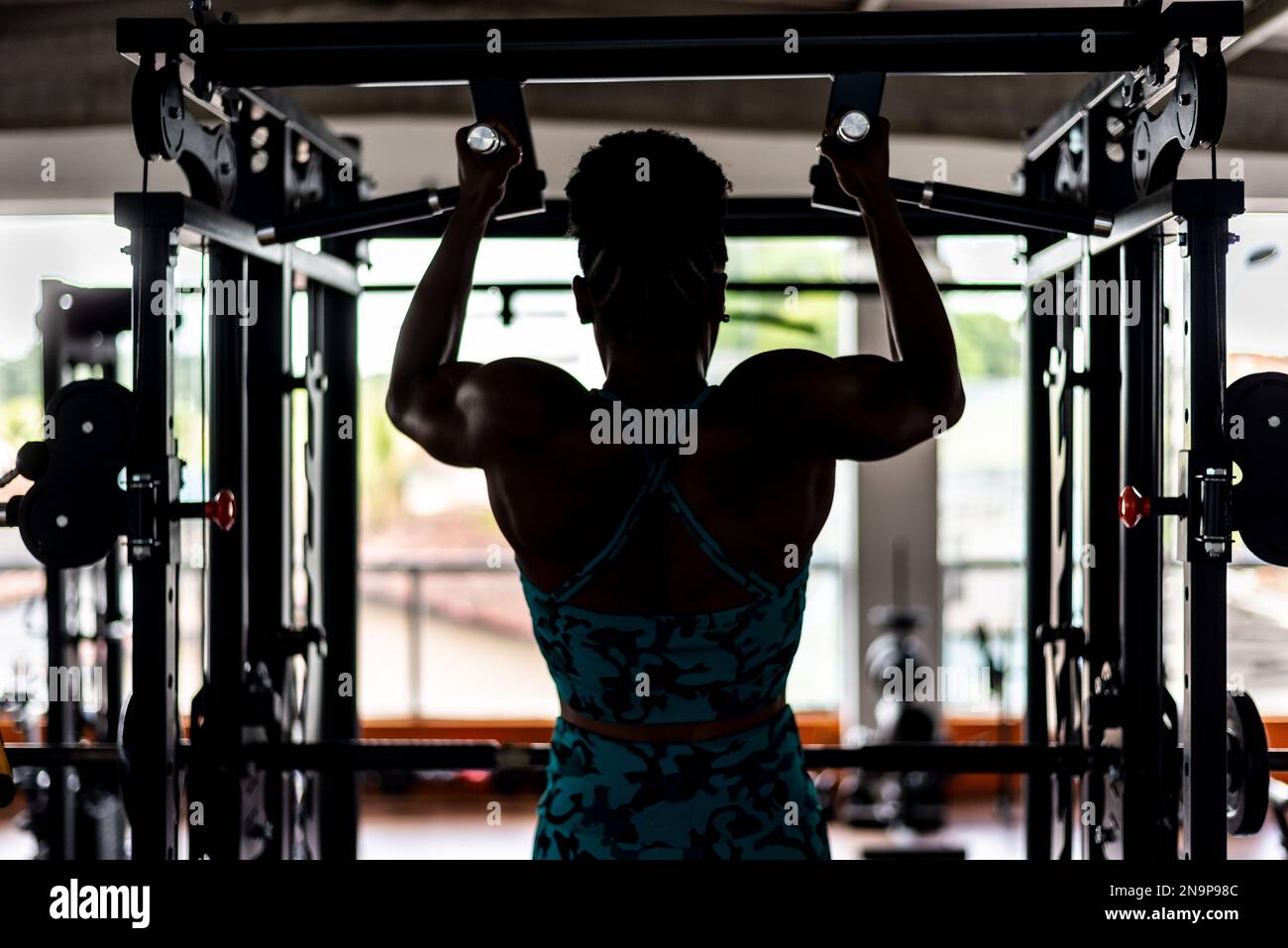 Muscular woman doing push-ups in the gym. Crossfit training Stock Photo ...