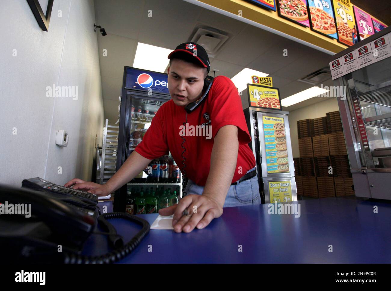 In this photo taken Thursday, May 24, 2012, Pizza Patron store manager ...