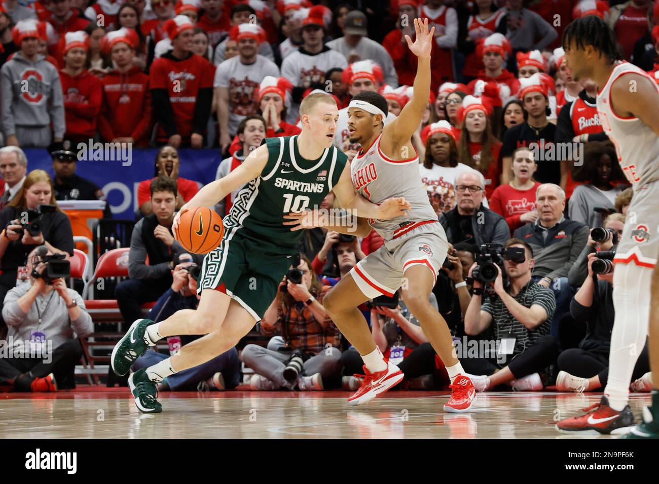 Michigan State's Joey Hauser, left, posts up against Ohio State's Roddy ...