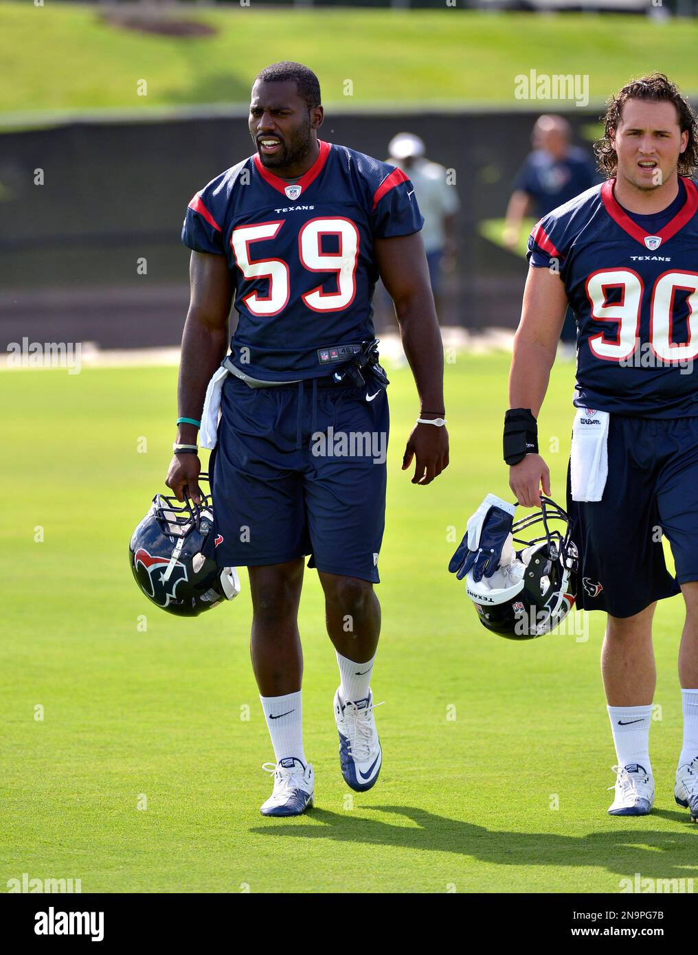 Houston Texans linebackers Whitney Mercilus (59) and Shawn Loiseau (90 ...