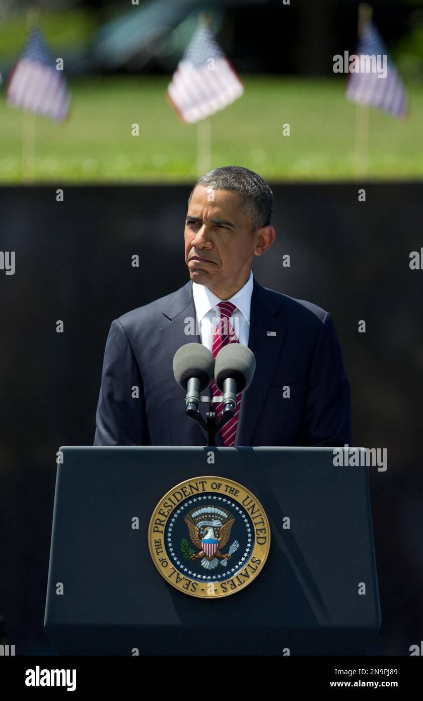 President Barack Obama pauses as he speaks during a Memorial Day ...