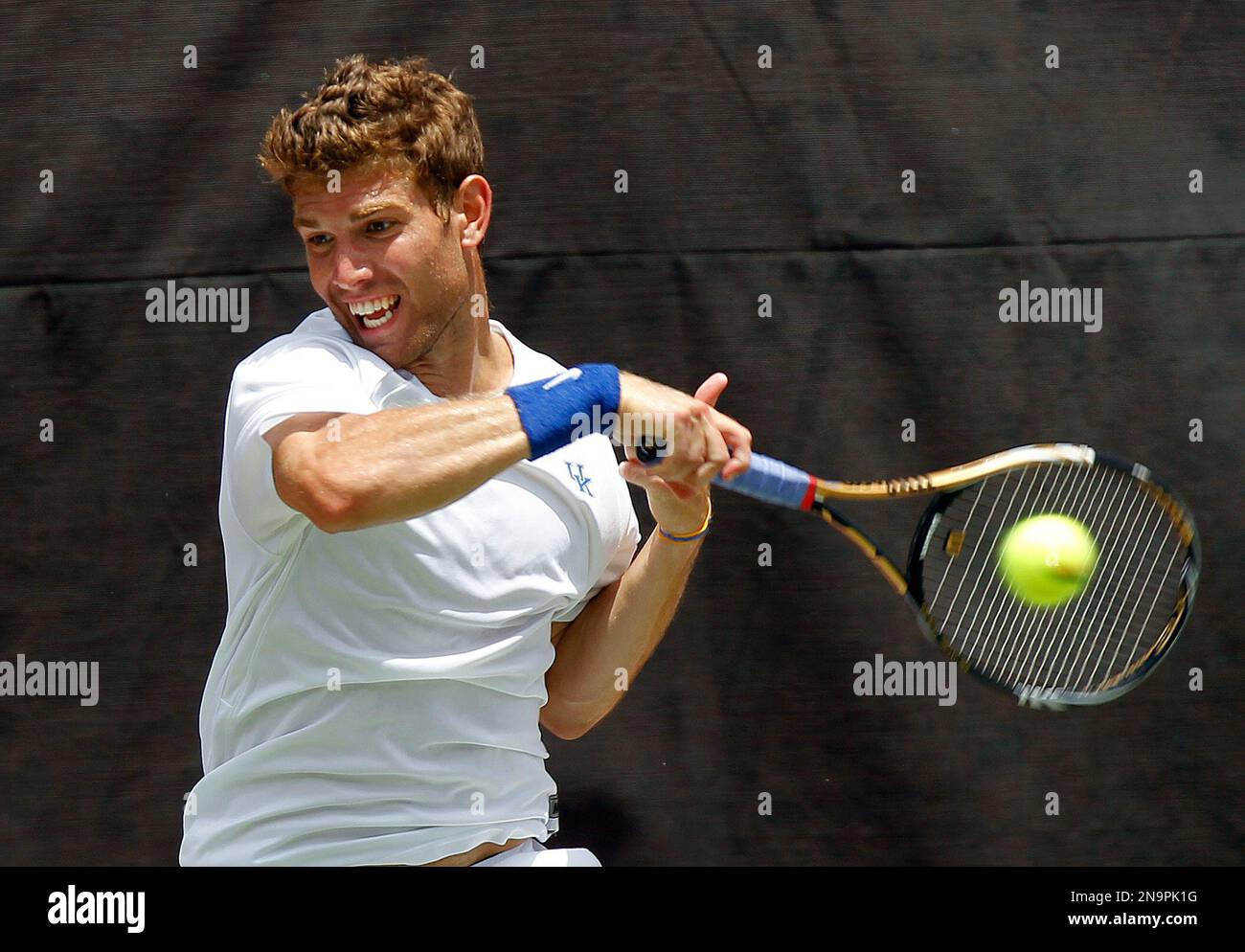Kentucky's Eric Quigley returns a shot during the finals of the NCAA ...
