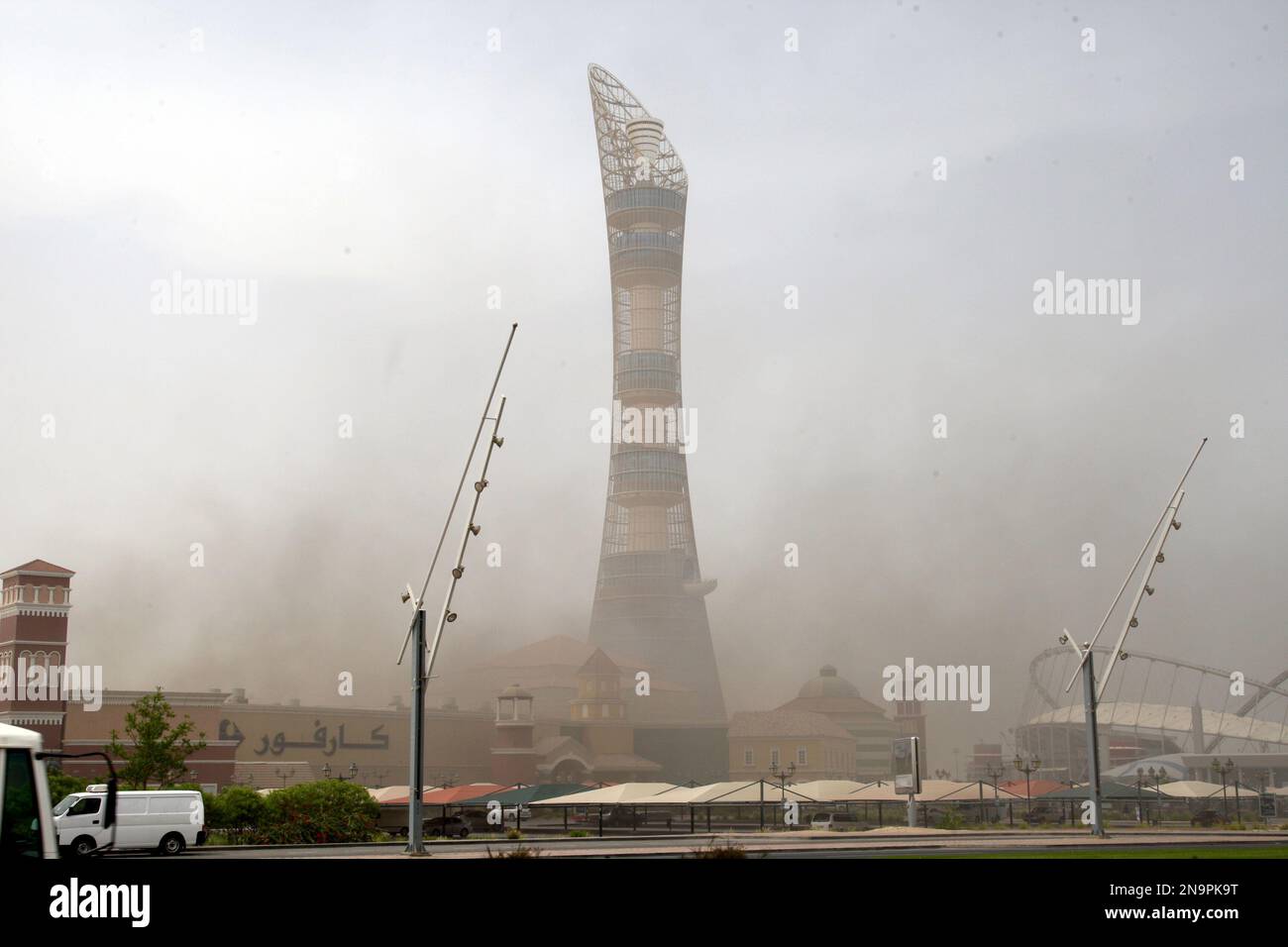 Smoke rises above the Villaggio Mall, in Doha's west end, as a fire ...