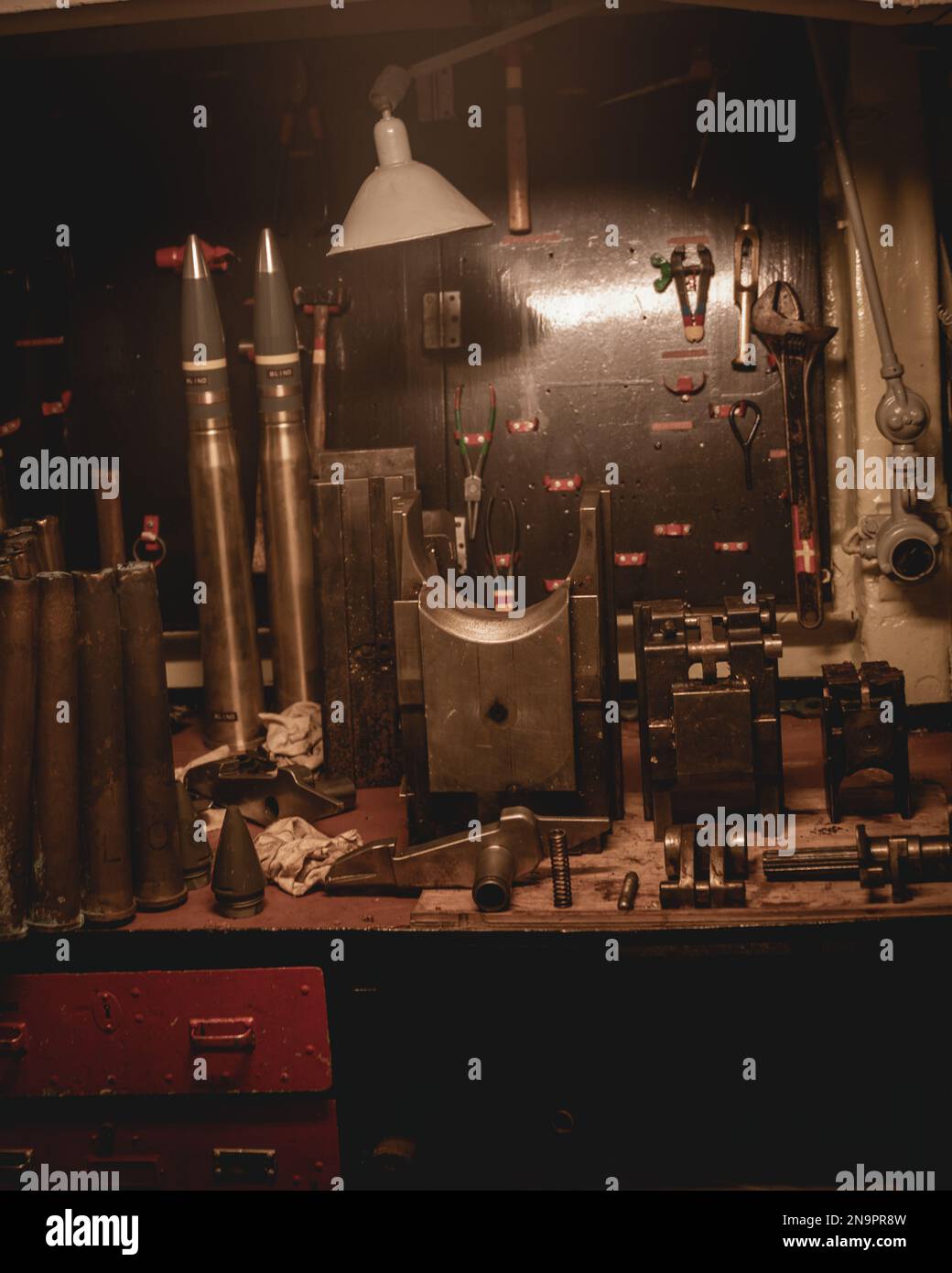 A workbench with ammunitions inside the weapons workshop aboard the ...