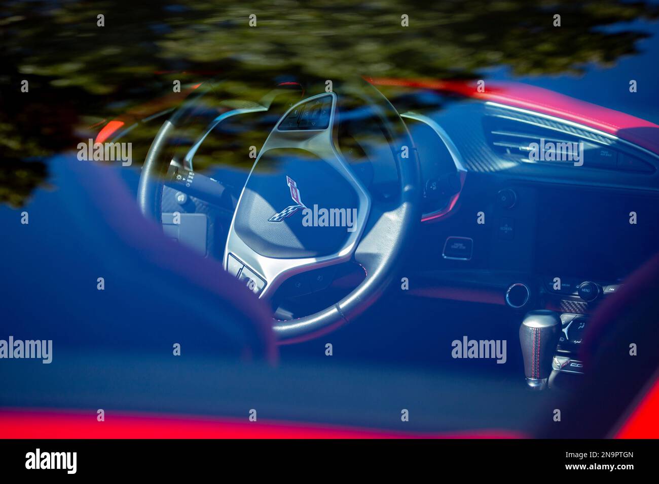 A beautiful shot of a driving steer of Chevrolet Corvette sport car in ...
