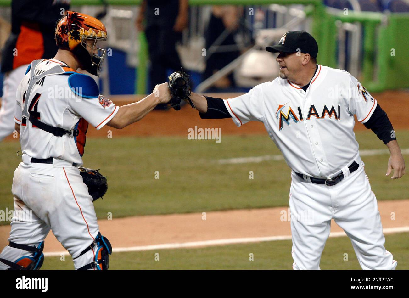 Miami Marlins relief pitcher Randy Choate, right, celebrates with ...