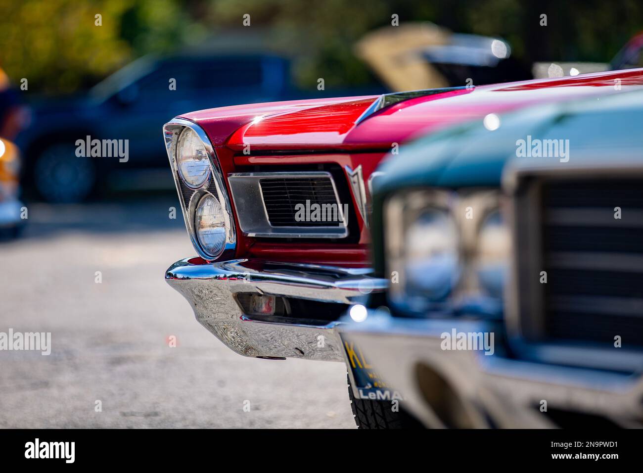 The front view of lights od blue and red Pontiac Firebird Grille cars ...
