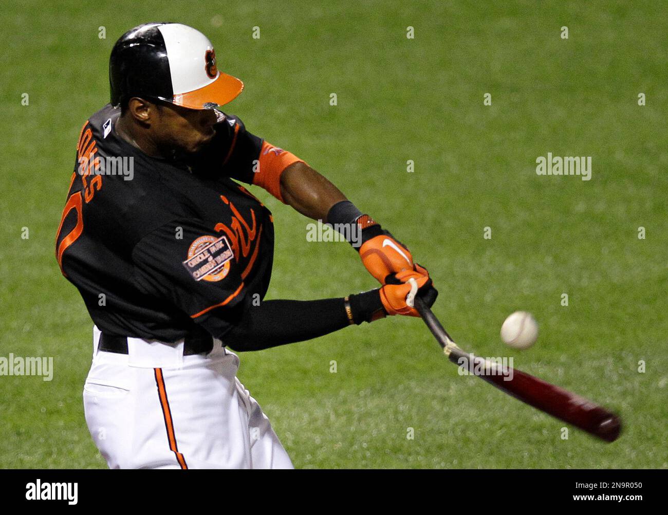 Baltimore Orioles' Adam Jones breaks his bat as he hits a foul ball in ...