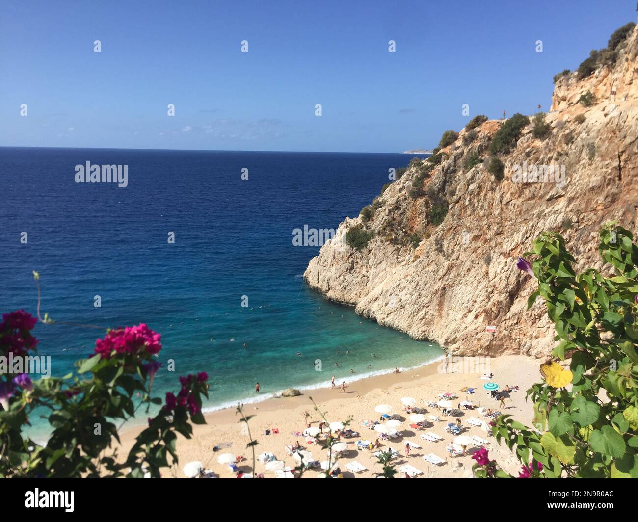Mediterranean Beach, blue water and light sky. Summer day landscape of ...