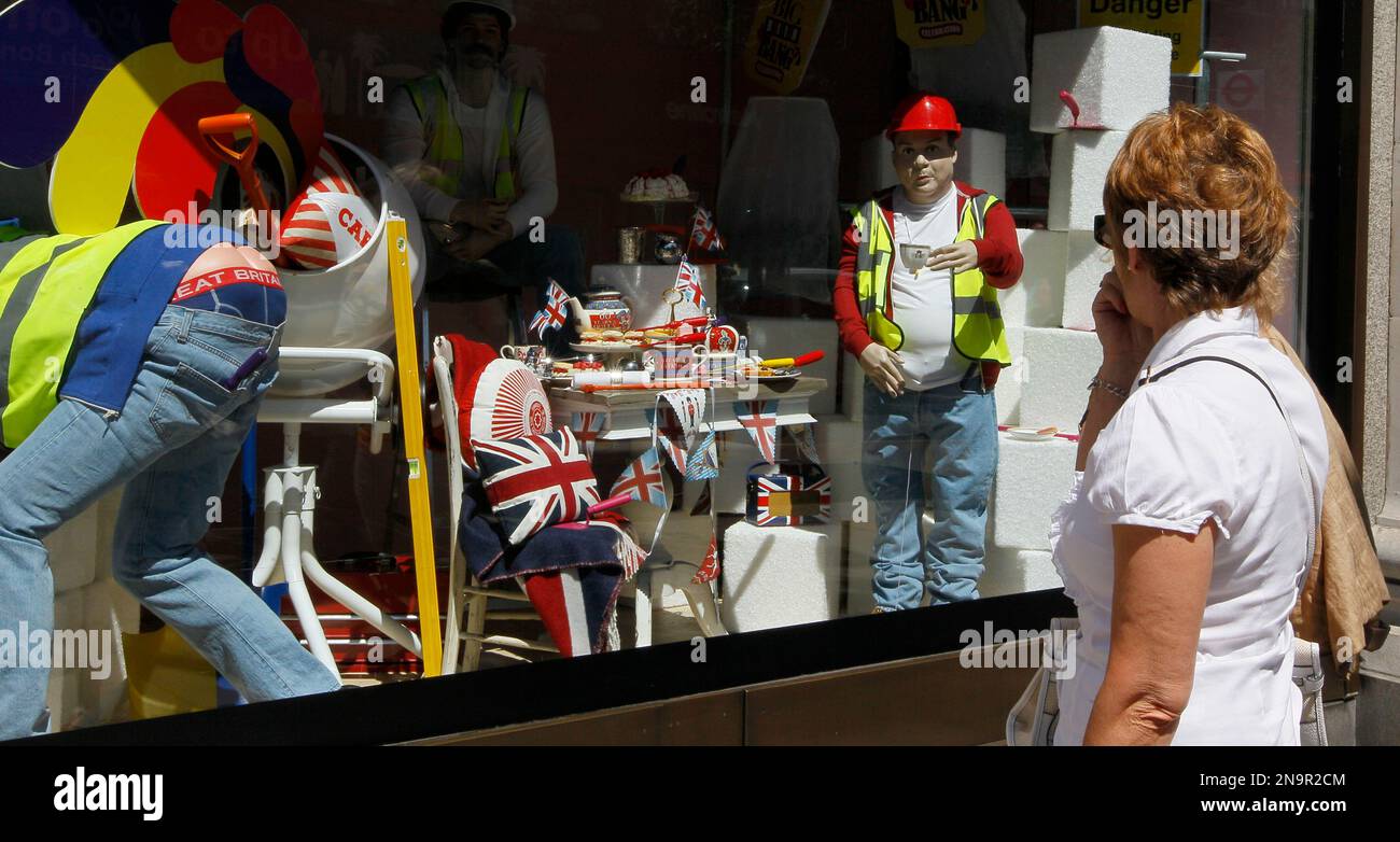 A shopper takes a look at a shop window display celebrating all things ...