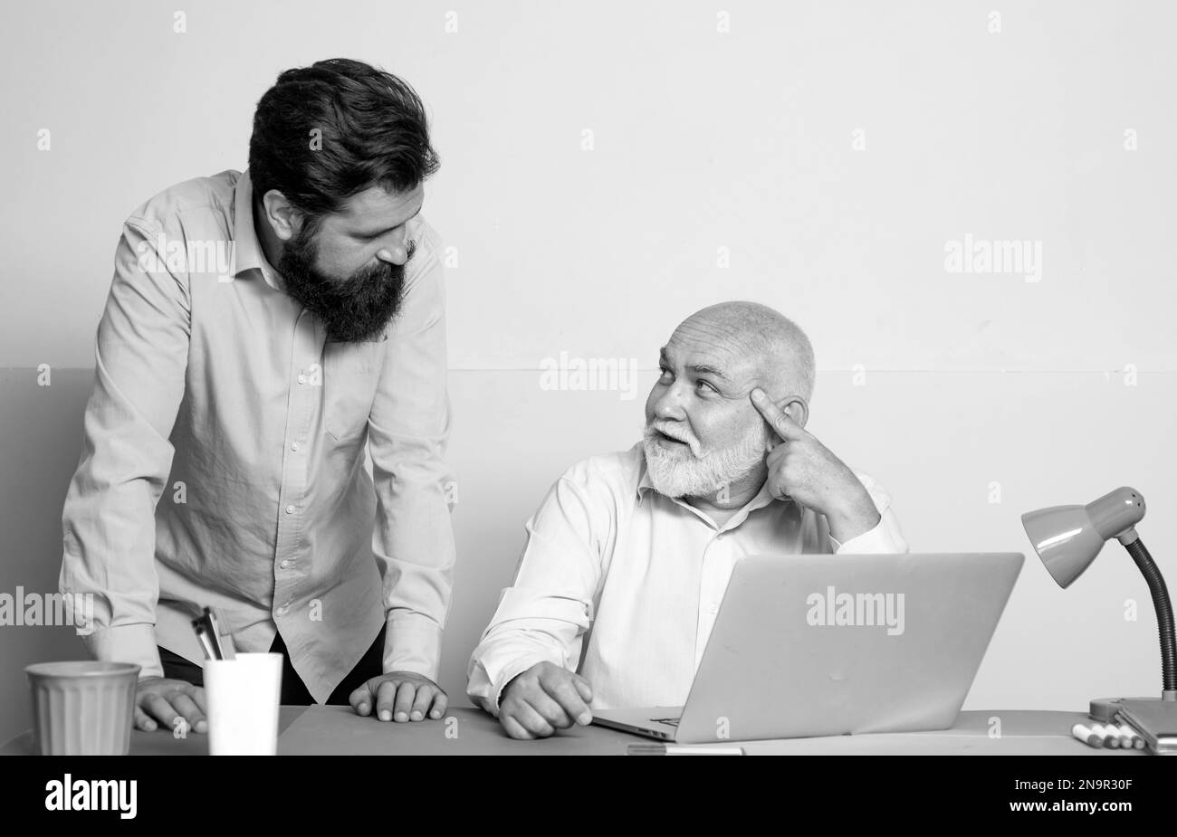 Male Multi Generation Family using Internet. Male workers chatting at ...