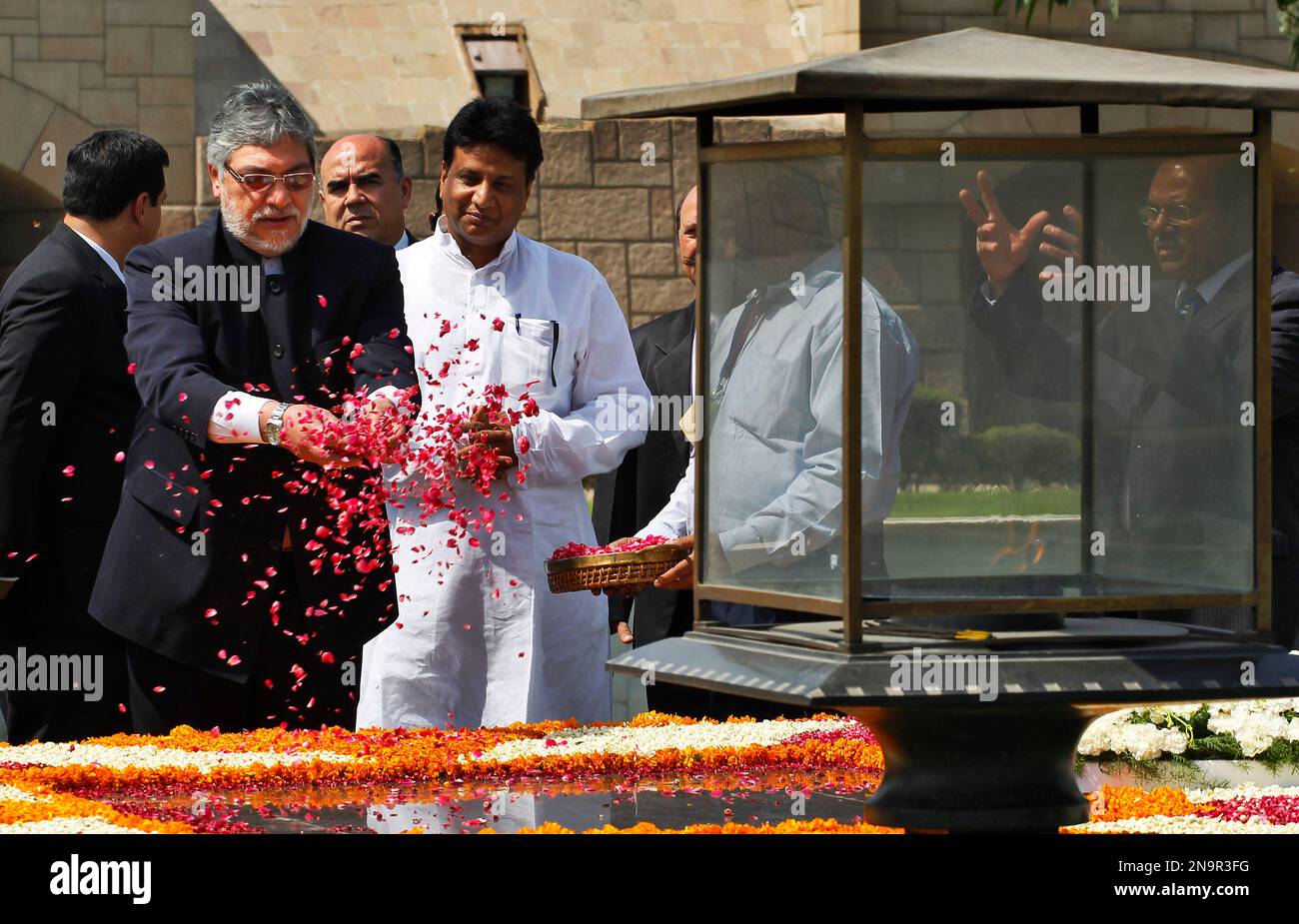 Paraguay President Fernando Lugo Mendez showers flower petals at the ...
