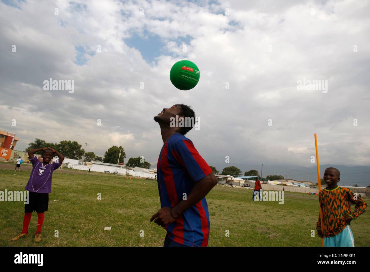 In this May 17, 2012 photo, soccer coach Rejouis Gachelin controls the ...