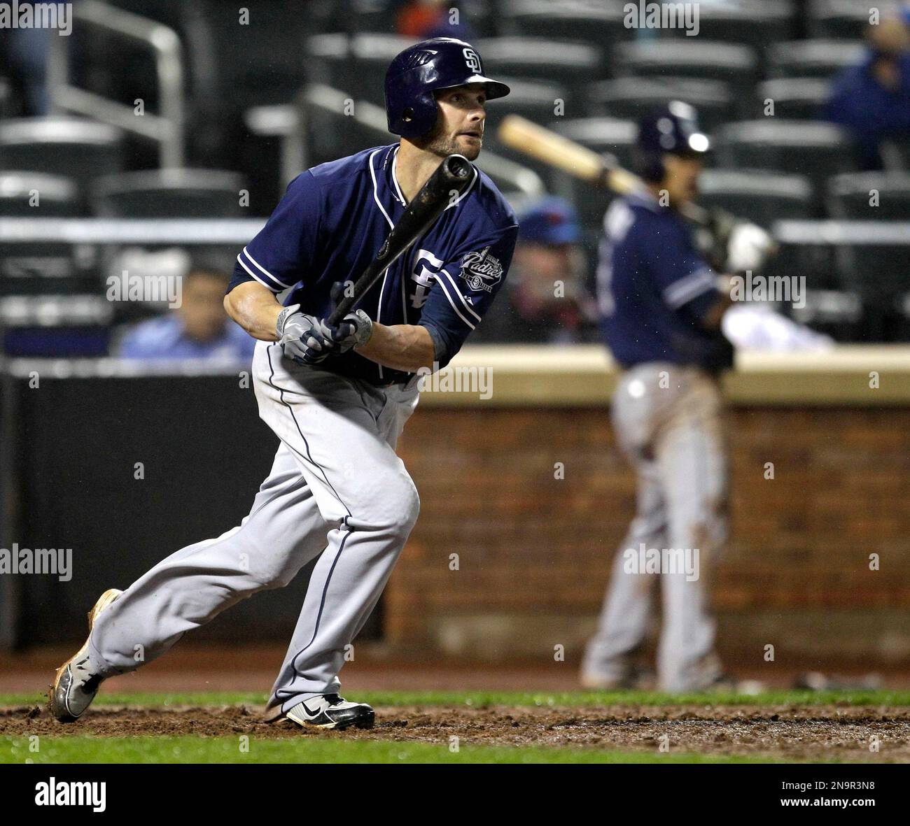 San Diego Padres' Andy Parrino, left, watches his two-run single off ...