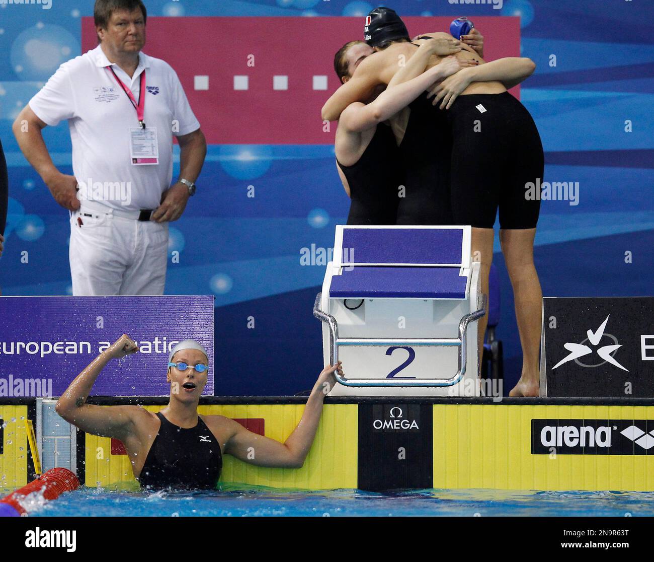 Italy's team celebrates after winning the Women's 4x200 meter Freestyle ...
