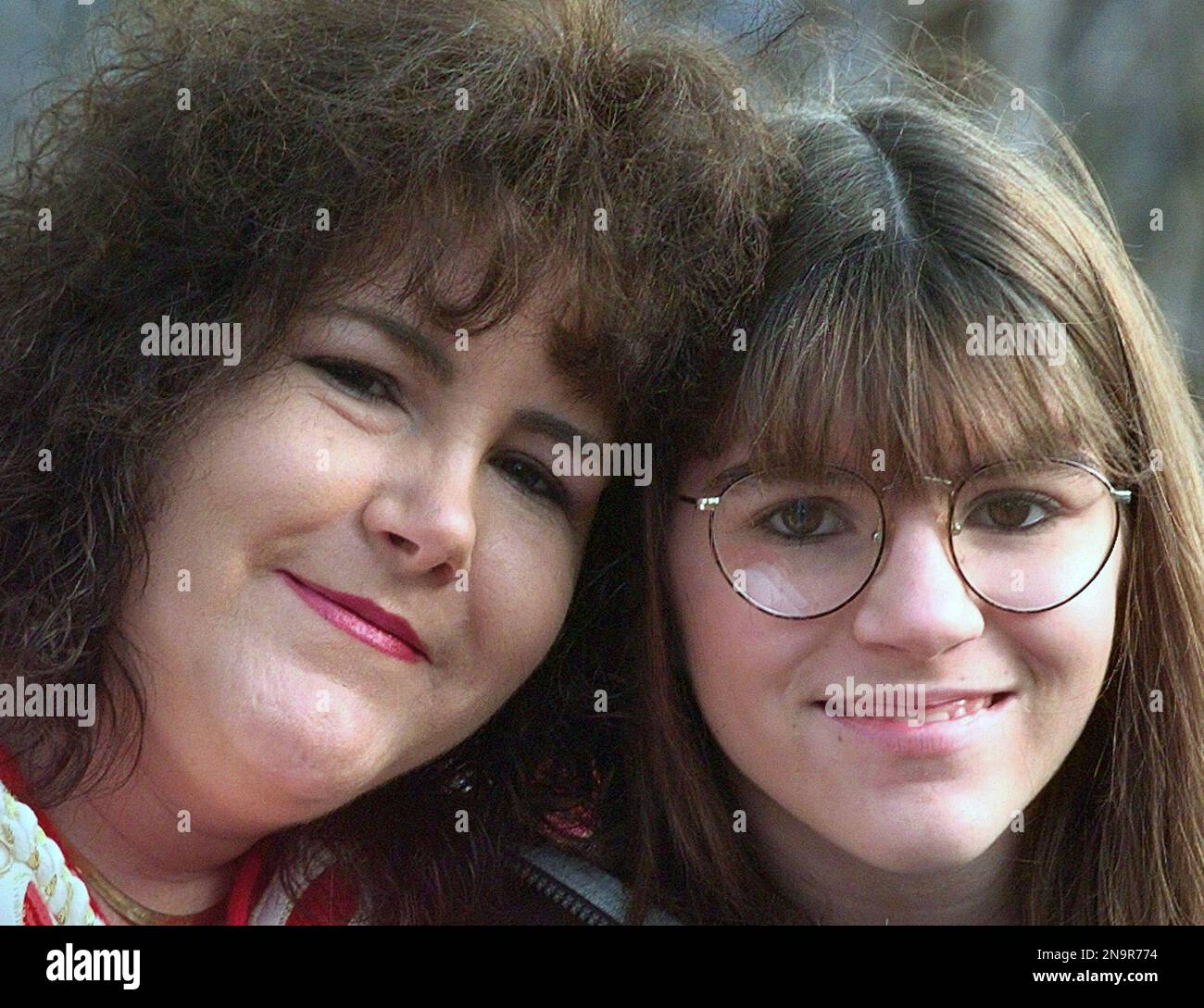 Carolyn Adkins and her daughter Amanda, 13, sit outside their Hurricane ...