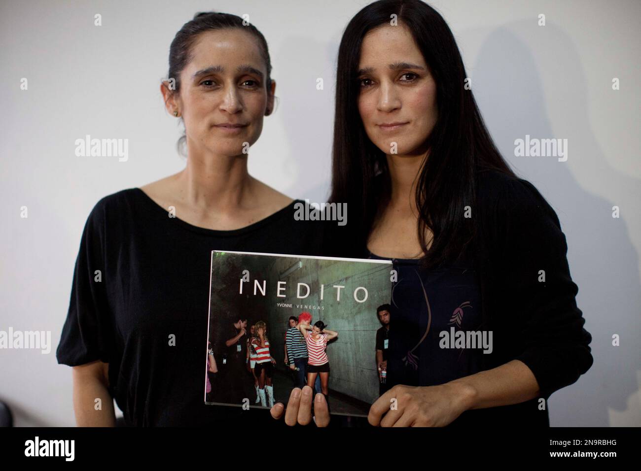 Mexican photographer Yvonne Venegas, left, poses for photos with her ...