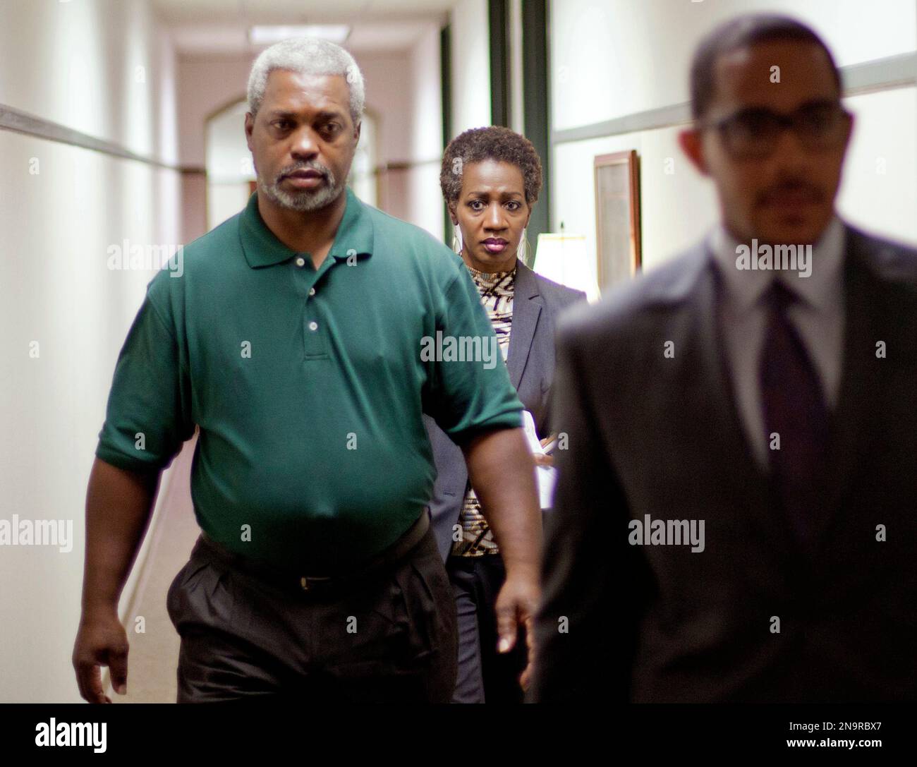 Pam Champion, center, and Robert Champion, Sr., left, the parents of ...