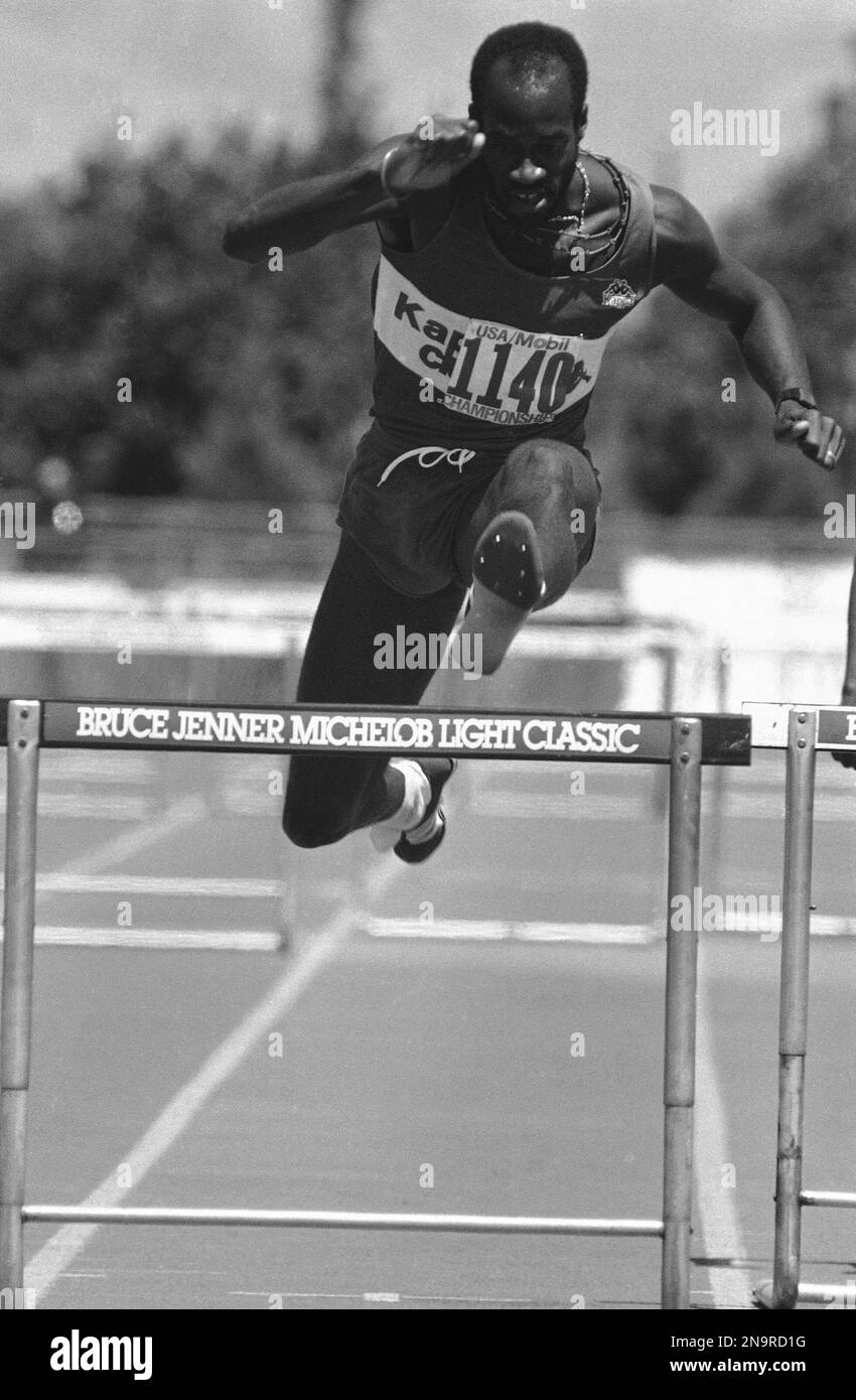 Edwin Moses leads the pack as he heads for the finish line in a time of 47:90 to win the 400 ...