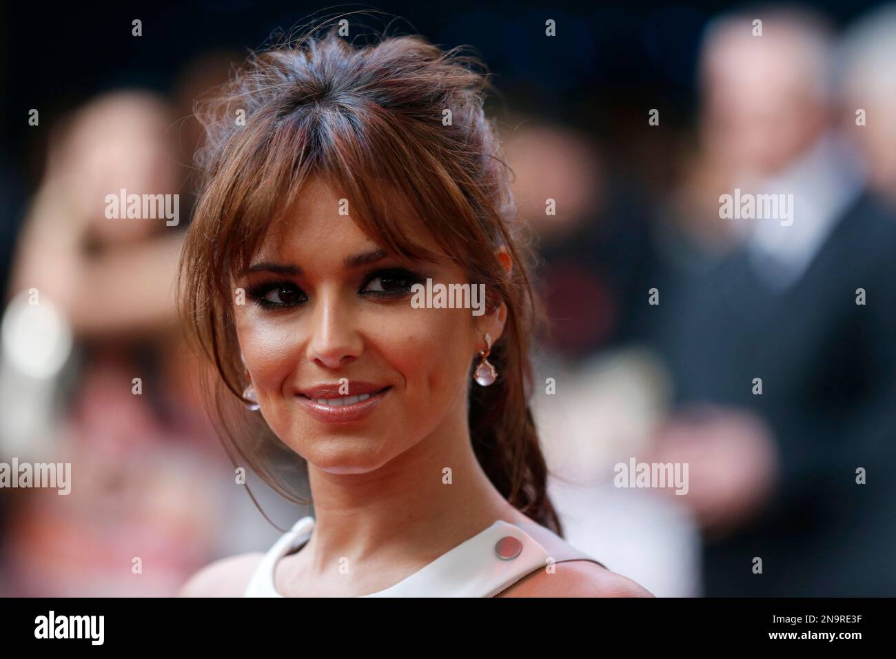 British singer Cheryl Cole poses for photographers as she arrives for ...