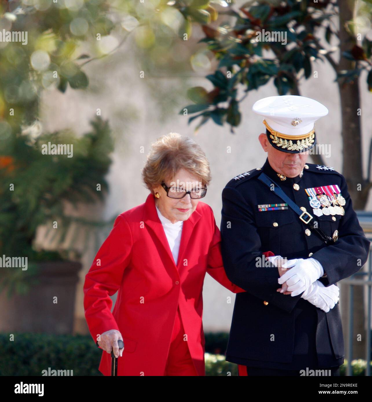 FILE - Former first lady Nancy Reagan is helped by Marine Lt. Gen ...