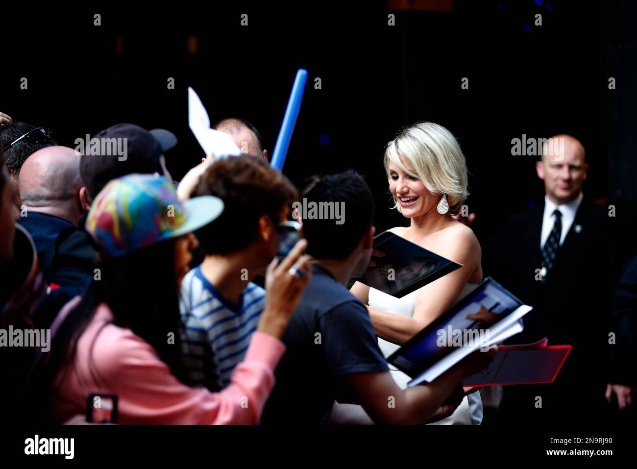U.S. actress Cameron Diaz signs autographs as she arrives for the ...