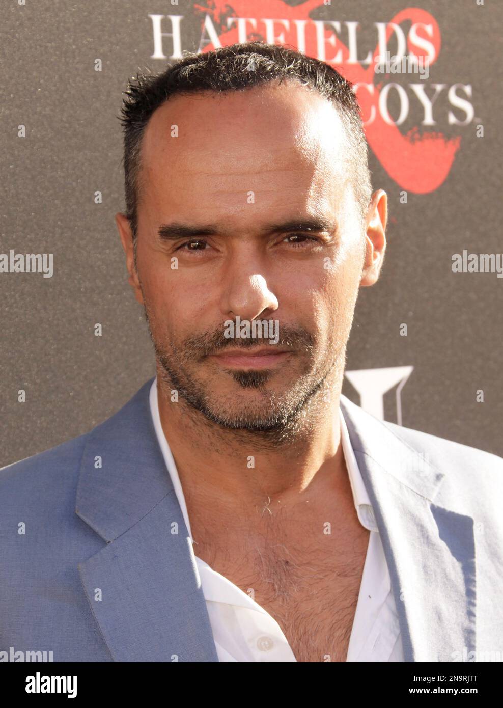 Actor Michael Greco arrives at the world premiere of Hatfields & McCoys ...
