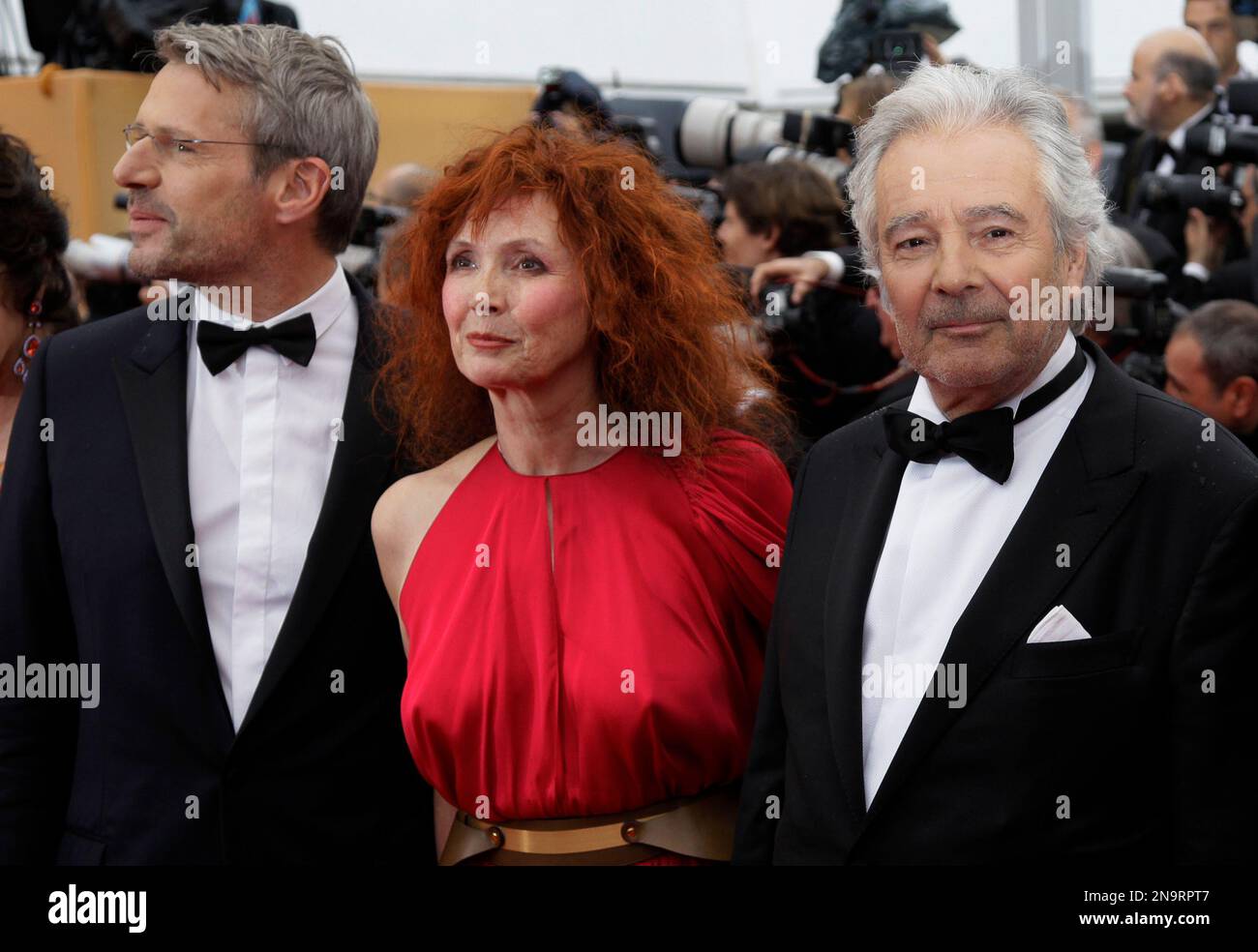 Actors Lambert Wilson, left, Sabine Azema and Pierre Arditi arrive for ...