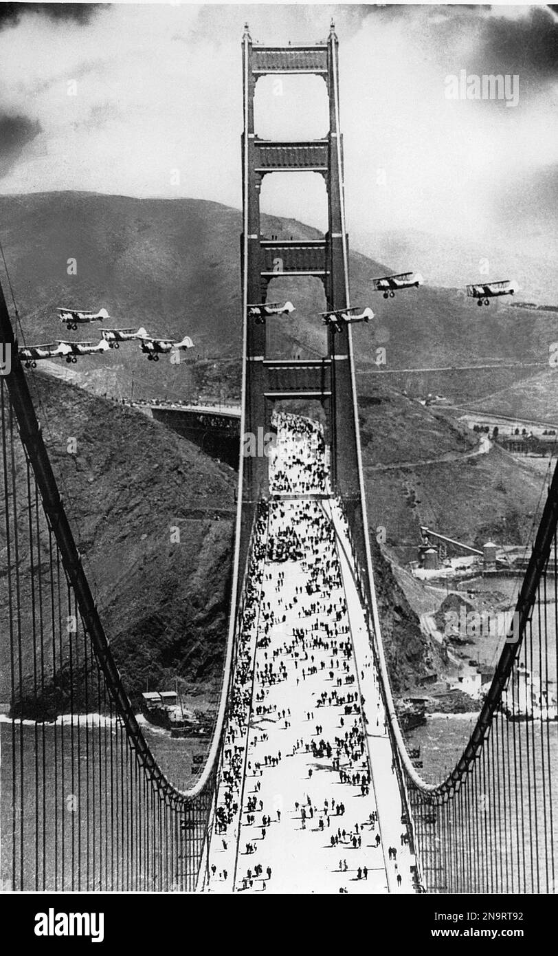 File - In this May 27, 1937 file photo, military biplanes fly between ...