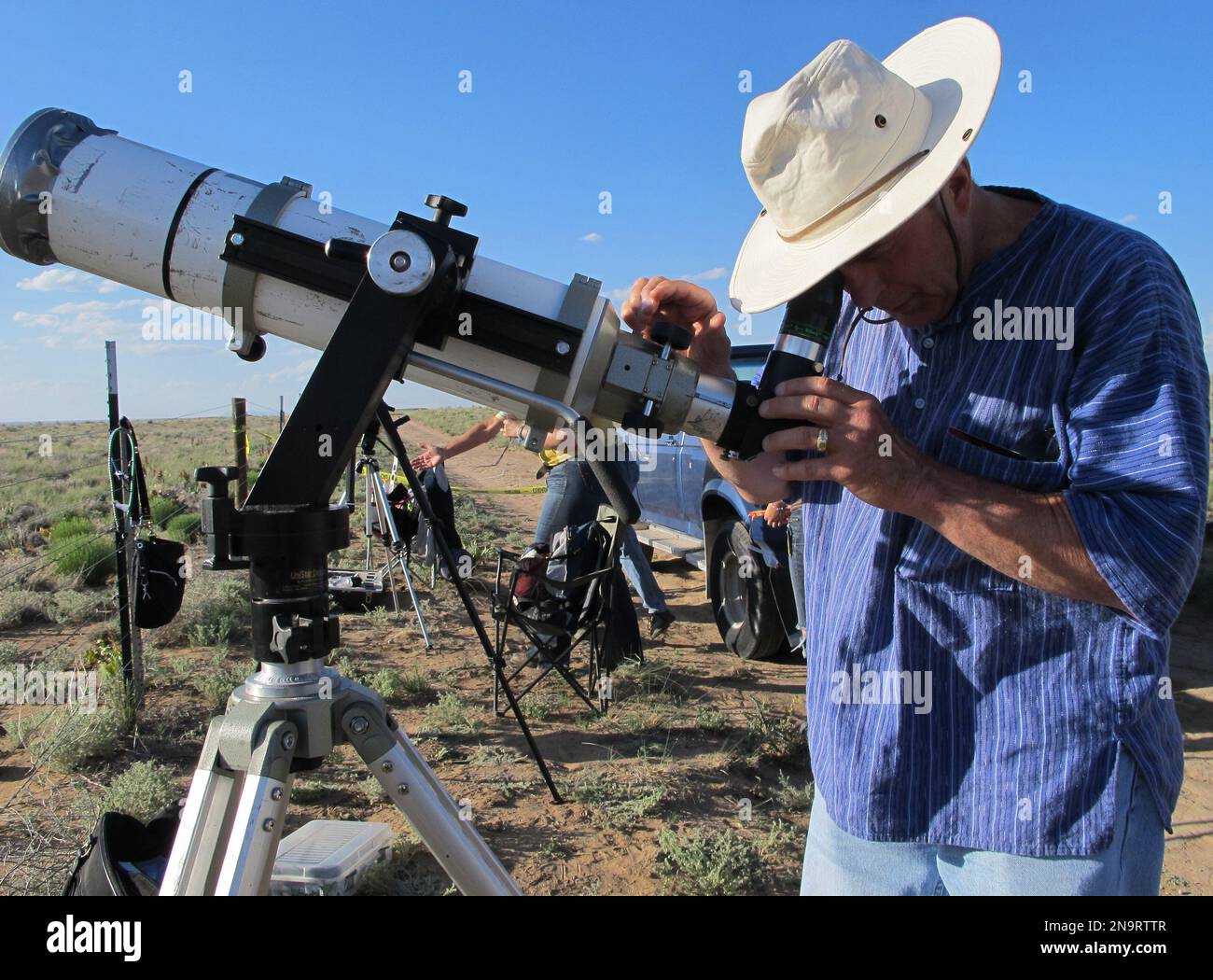 Alan Macklem of Manitoba, Canada, looks at sunspots during the annular ...