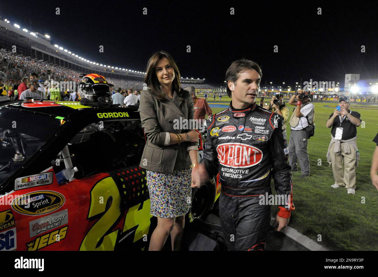 Jeff Gordon, right, stands by his car with wife Ingrid Vandebosch, left ...