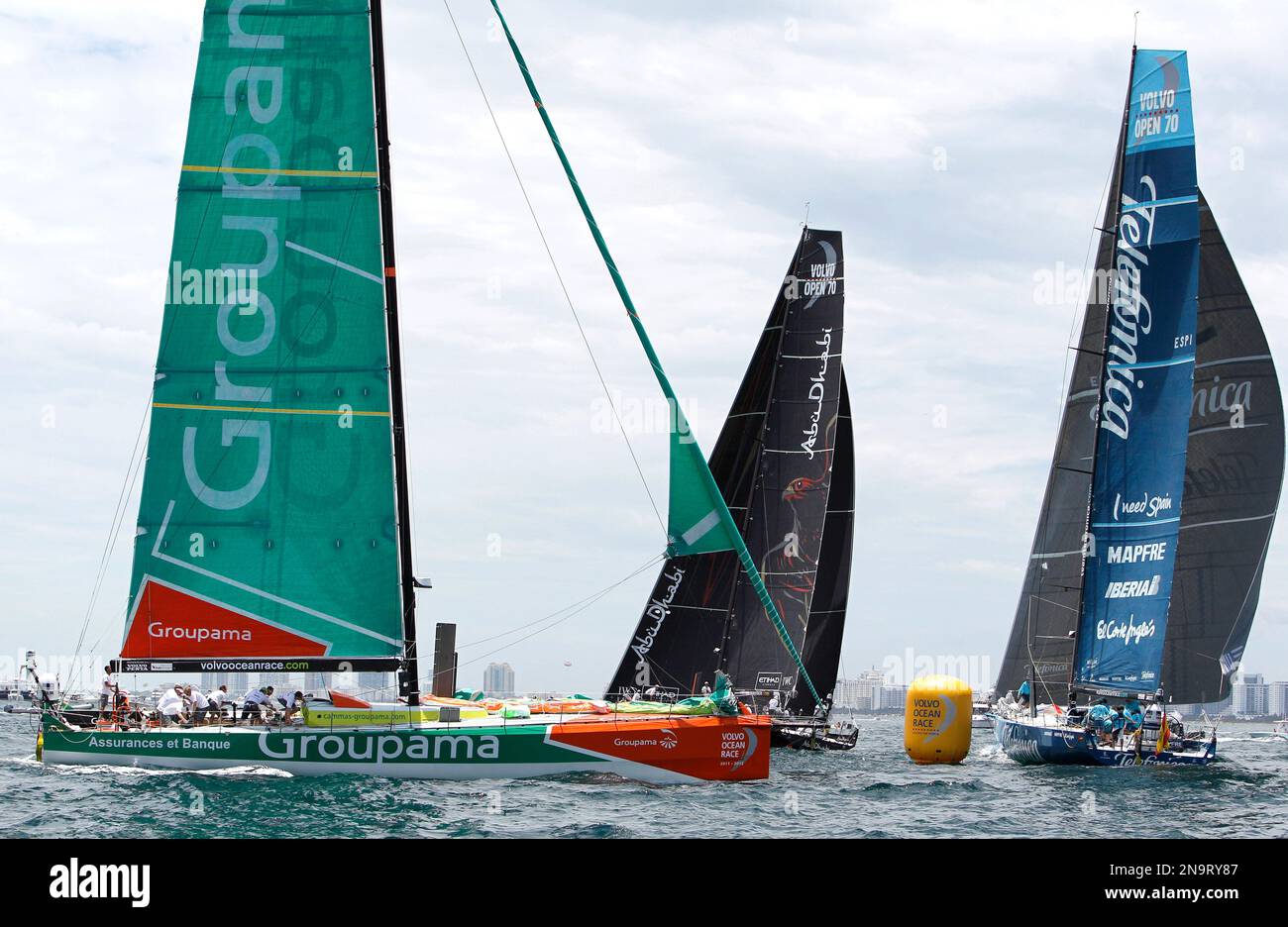 Groupama Sailing Team, left, Team Telefonica, right, and Abu Dhabi ...