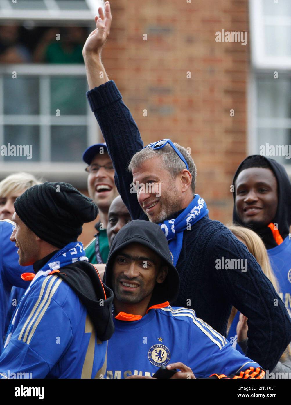 Chelsea owner Roman Abramovitch, centre, waves to supporters as he ...