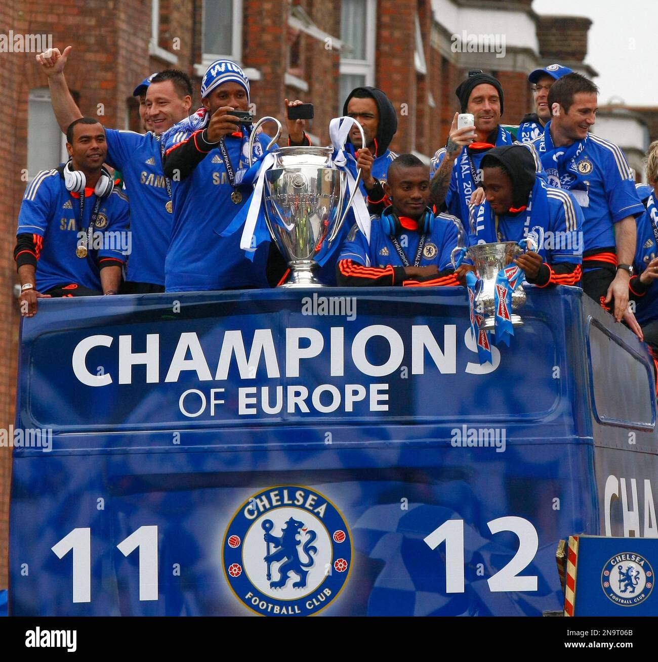 Chelsea players and staff celebrate during an open top bus victory ...