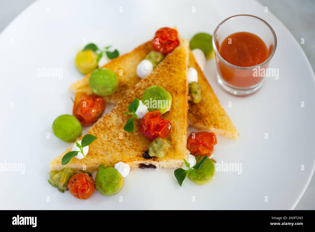 Close-up of Avocado Toast. Breakfast on white plate. Two bread ...