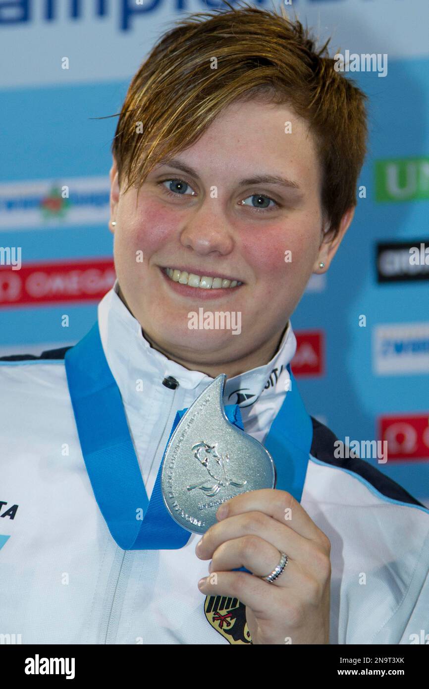 Uschi Freitag of Germany poses with her silver medal on the podium of ...