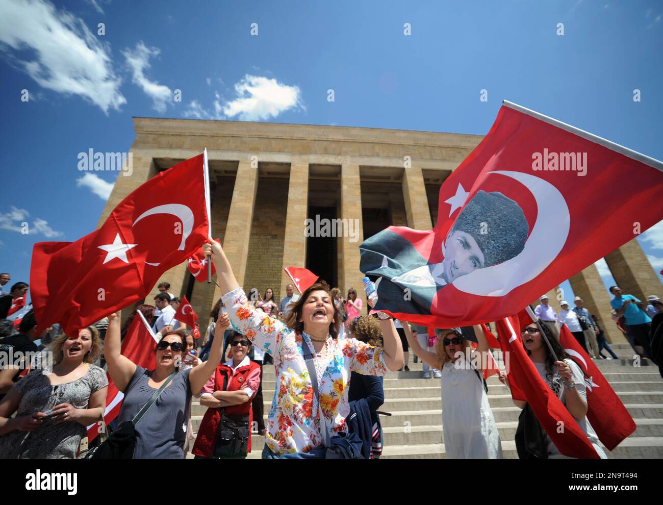 People wave national flags as they visit the mausoleum of Mustafa Kemal Ataturk, founding father ...