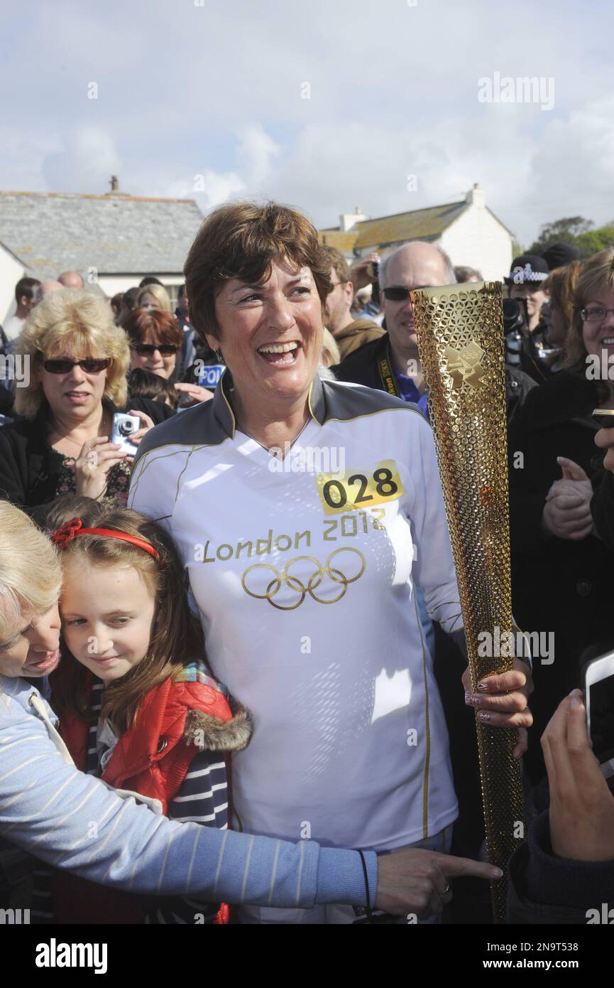 Sarah Blight holds the London 2012 Olympic torch with her patriotic ...