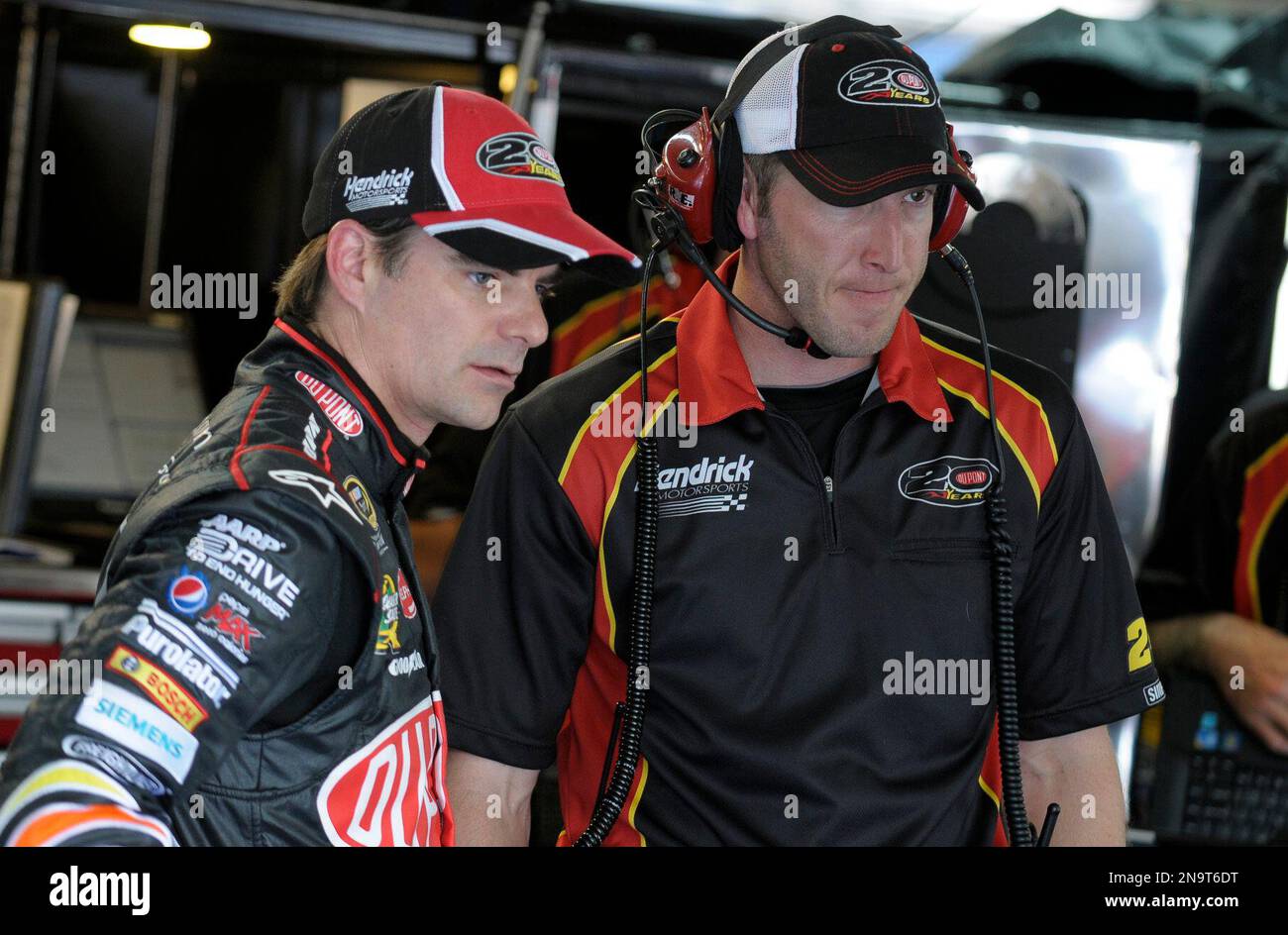 Jeff Gordon, left, waits with his crew chief Alan Gustafson, right ...