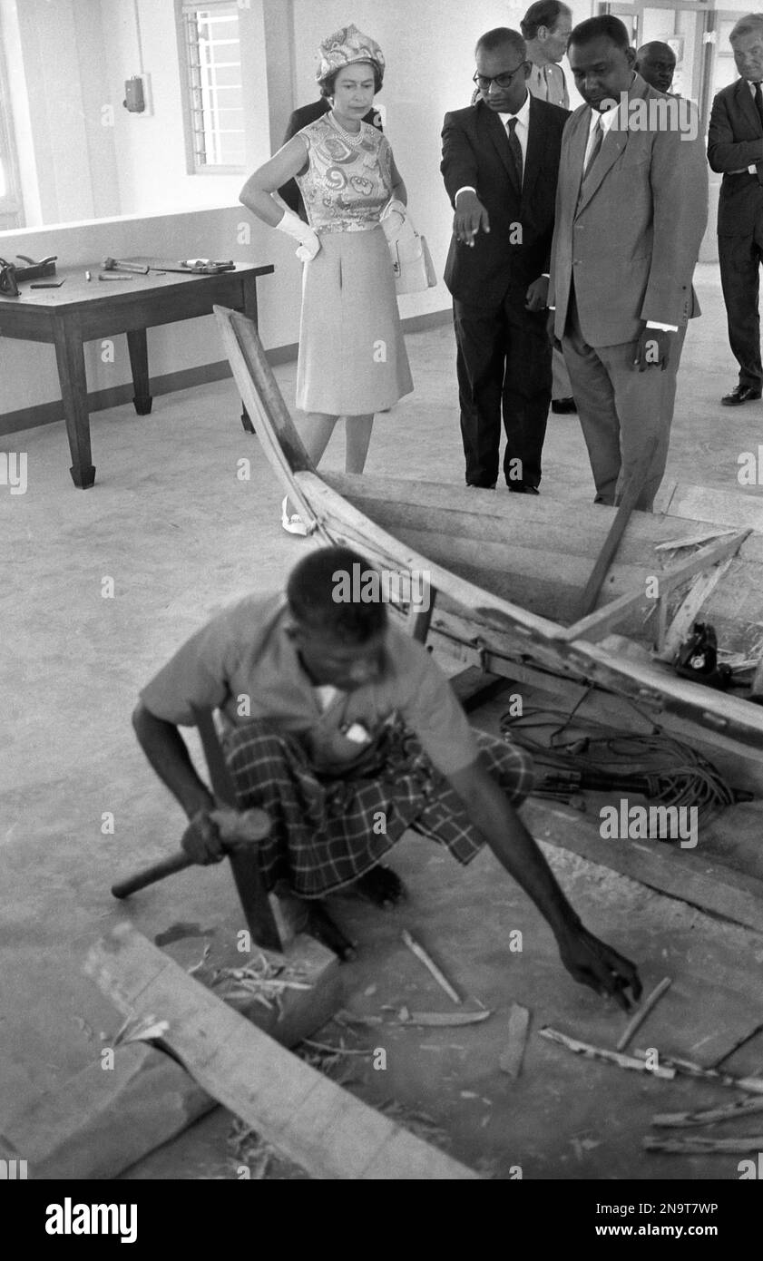 Britain's Queen Elizabeth II sees a boat being built during a two-day ...