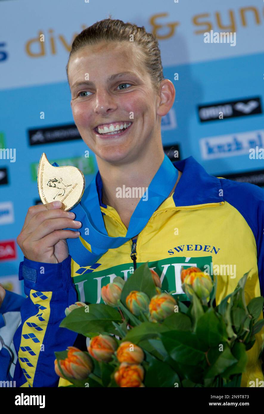 European champion Anna Lindberg of Sweden shows her gold medal as she ...