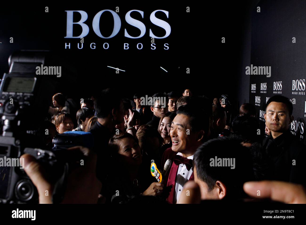 Hong Kong actor Chow Yun Fat, center, speaks to journalists at the Hugo ...