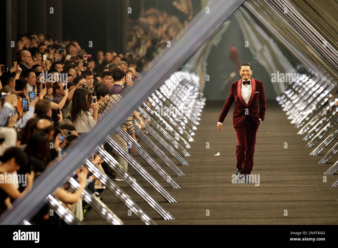 Hong Kong actor Chow Yun Fat walks down the cat walk during the Hugo ...