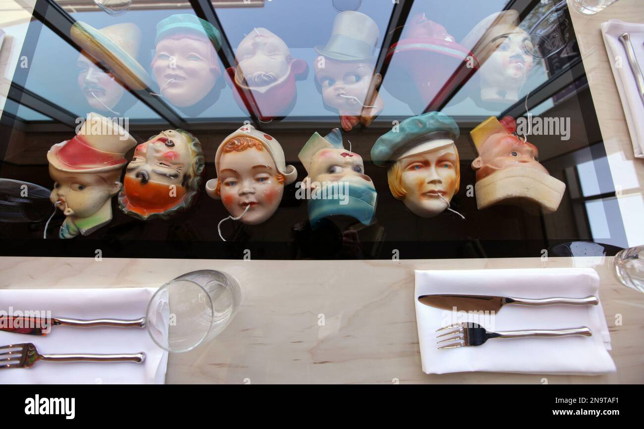 Vintage string holders are seen built into a table top display in the ...